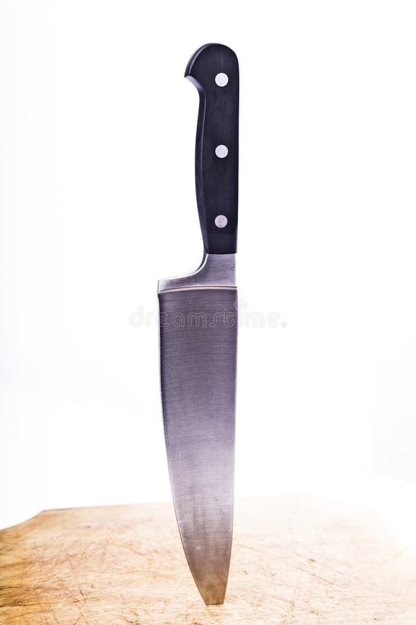 Big Sharp Knife Stabbed into a Wooden Table Stock Photo - Image of ...