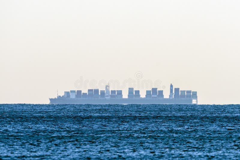 Big Ship Mirage on Sea Horizon Line Stock Photo - Image of cargo ...