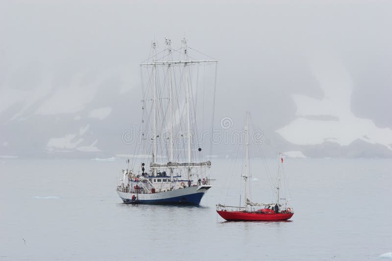 Big Ship and Small Yacht in Arctic Fjord Stock Image - Image of ship ...