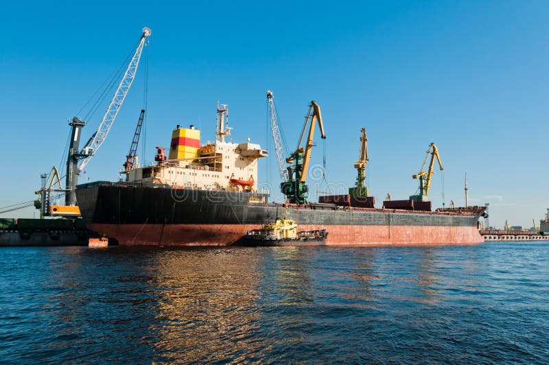 Big Ship Unloading in Shipyard Stock Photo - Image of dockside ...