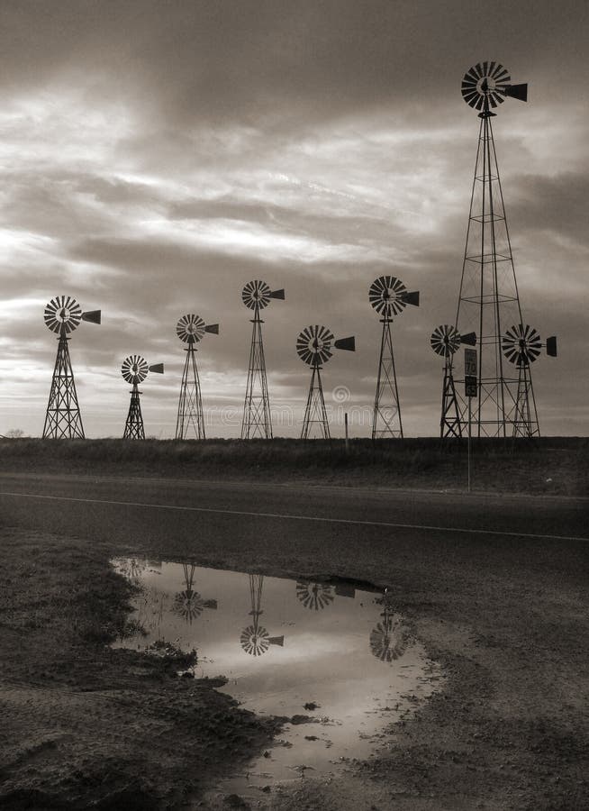 Big Sky Texas Windmills stock image. Image of plains, puddle - 4383885