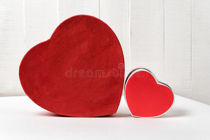 Big and Small Red Heart Shaped Boxes on Table. Side View Stock Photo ...