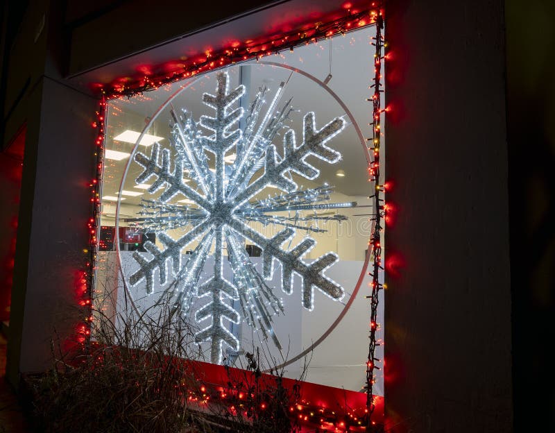 Big Snowflake Light in a Window Stock Image - Image of decorative, snow ...