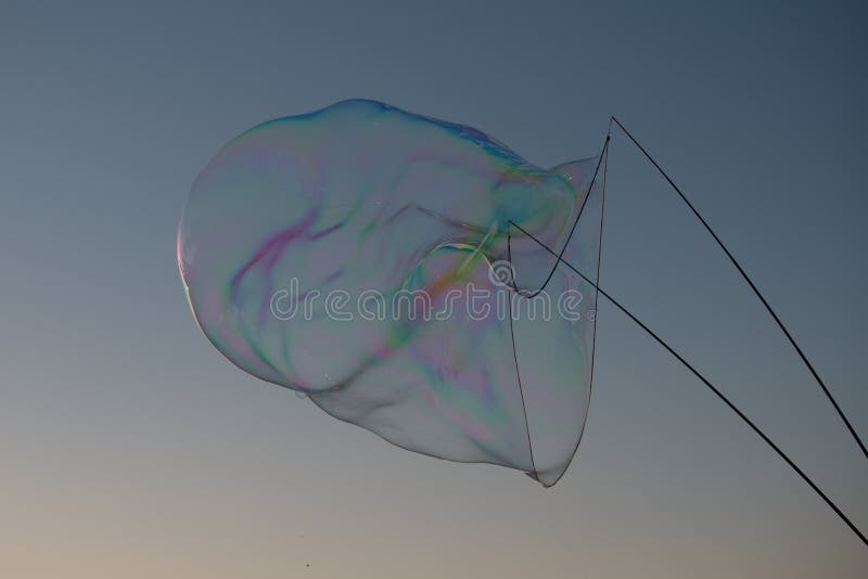 Big Soap Bubbles on Sky Background. Bubble Making with Rope and Sticks ...