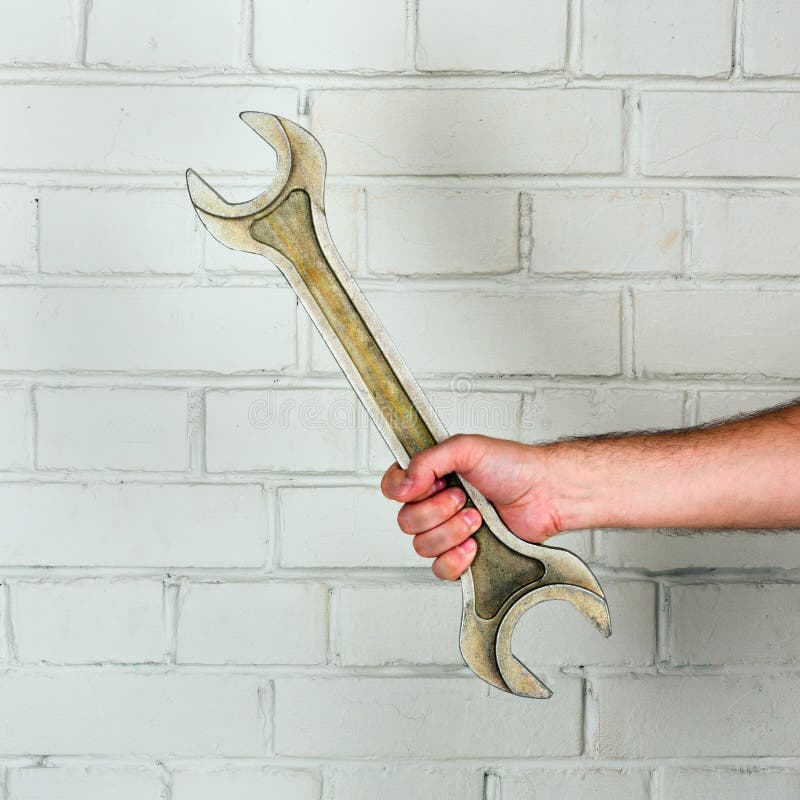 Spanner in a man's hand stock image. Image of object - 10922289