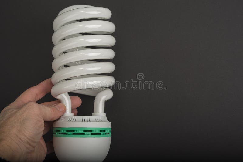 Big Spiral CLF Bulb on a Black Stock Image - Image of black, power ...