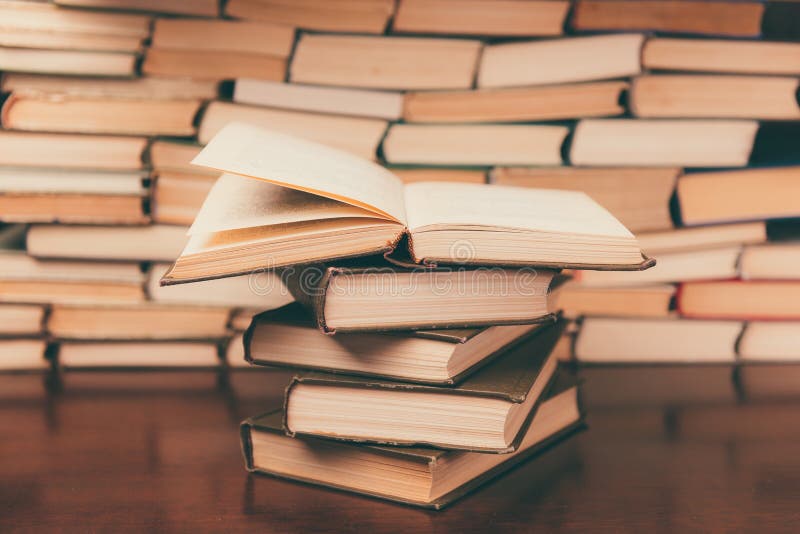 Big Stack of Books on the Wooden Table Stock Photo - Image of group ...