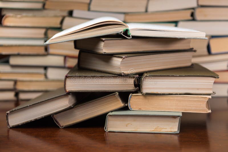Big Stack of Books on the Wooden Table Stock Photo - Image of library ...