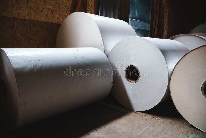 Big Stack of Printing Paper Rolls in Warehouse. the Concept of ...