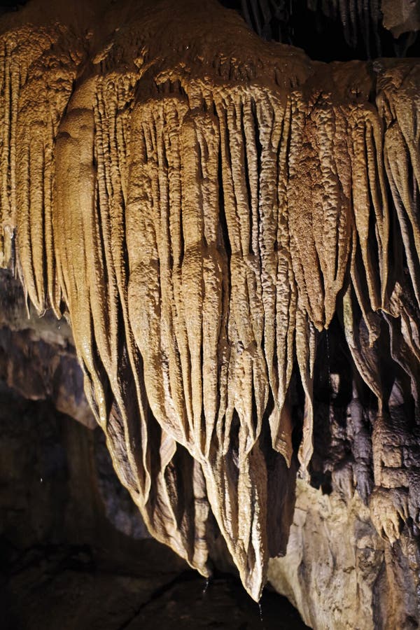 A Big Stalactite is Hanging from the Rock Stock Photo - Image of beauty ...
