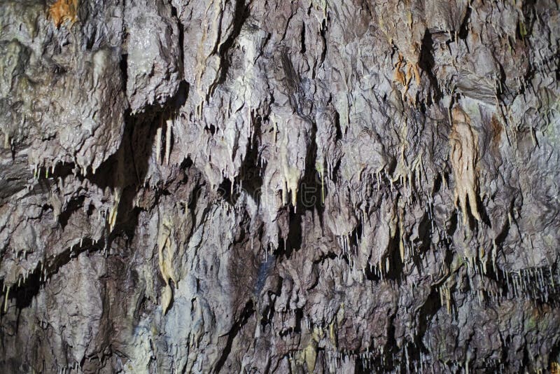 A Big Stalactite is Hanging from the Rock Stock Image - Image of giant ...