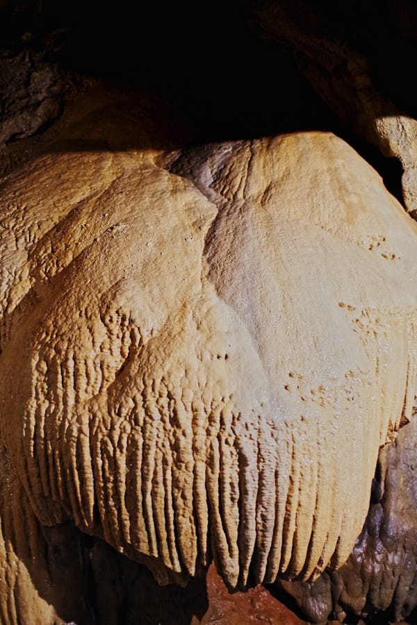 A Big Stalactite is Hanging from the Rock Stock Image - Image of ...