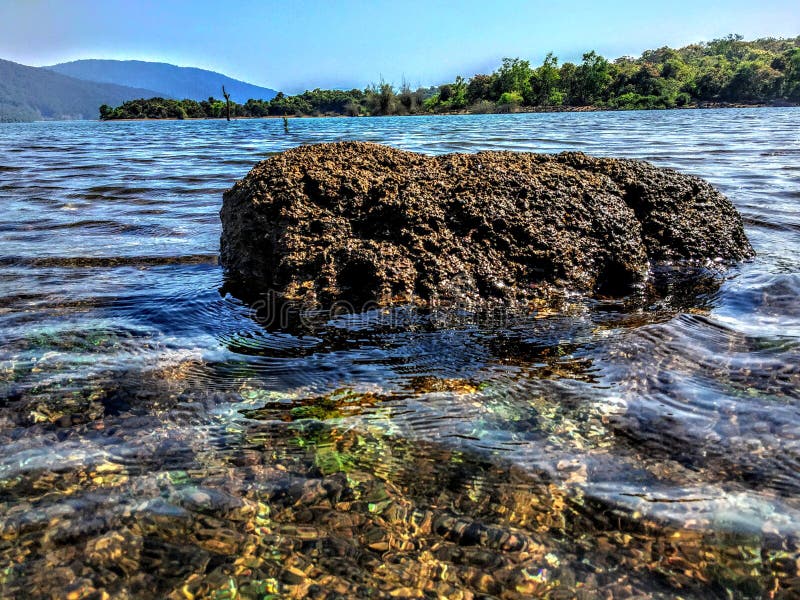A Big Stone in the Middle of River Stock Photo - Image of nature ...
