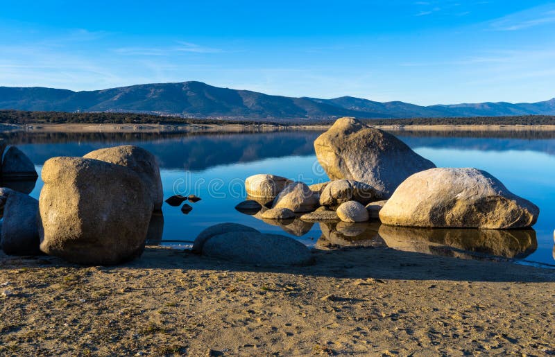 Big Stone or Rock in Lake or See with Mountains in Background Stock ...
