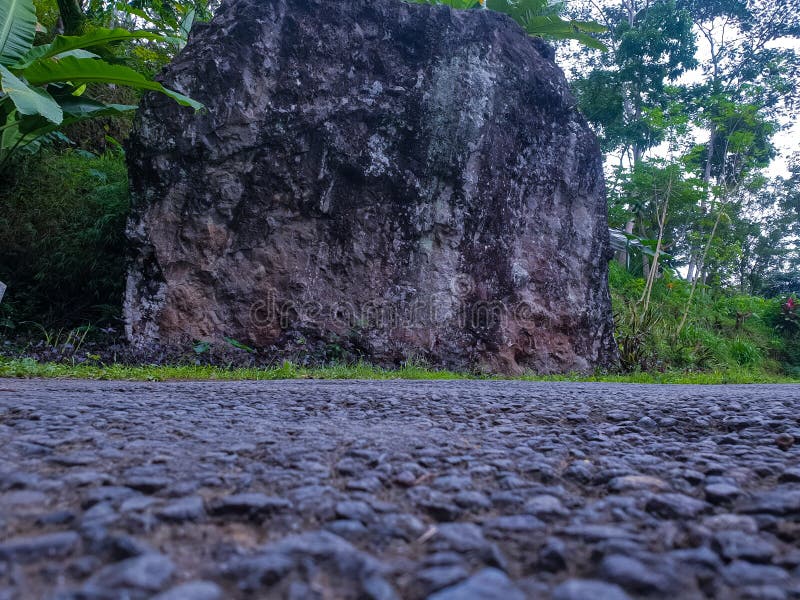 Big Stone on the Side of the Road Stock Image - Image of soil, road ...