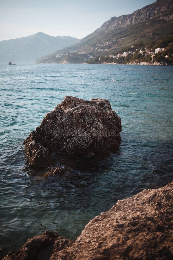 Big Stone Sticks Out of the Water in the Sea Stock Photo - Image of ...