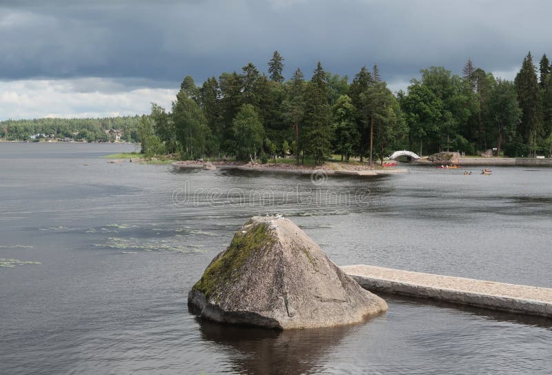Big stone in the water stock image. Image of boating - 252689763