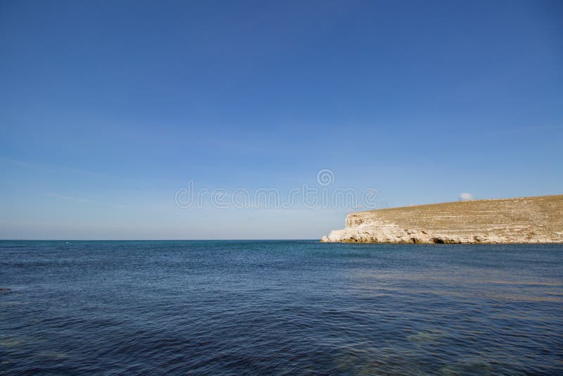 Big Stones Calm Sea, Clear Sky with Clouds Skyline and Infinity Stock ...