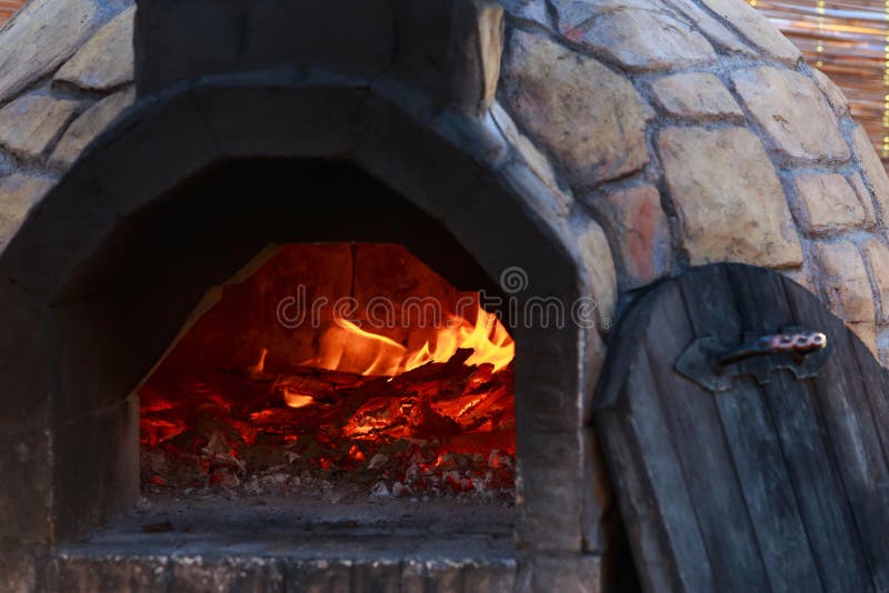 Big stove with fire stock photo. Image of woodstove - 260945440