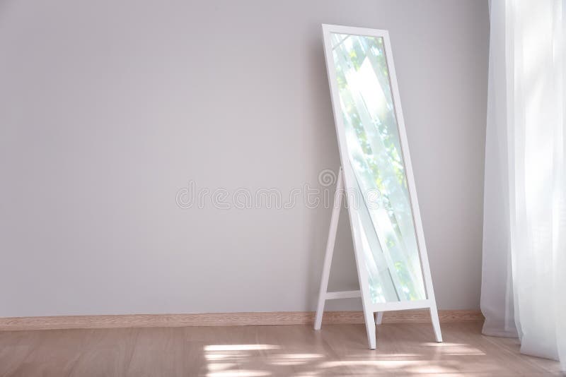 Big Stylish Mirror Near Light Wall in Empty Room Stock Photo - Image of ...