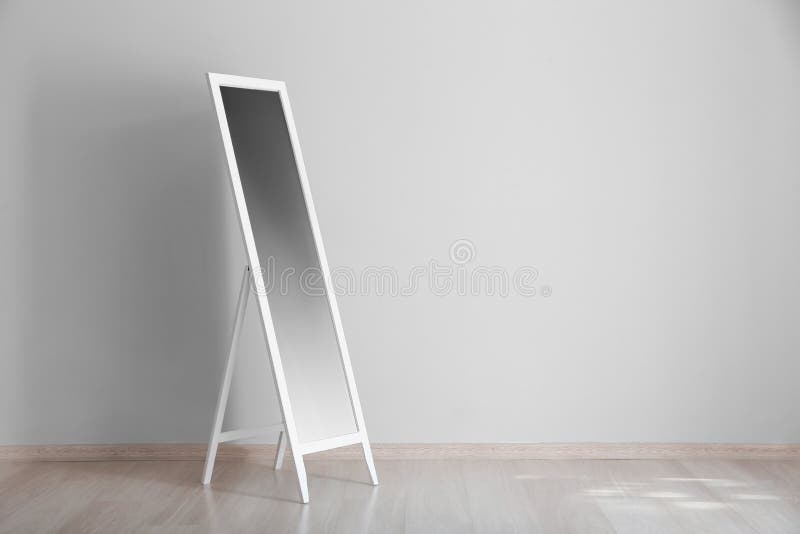 Big Stylish Mirror Near Light Wall in Empty Room Stock Image - Image of ...