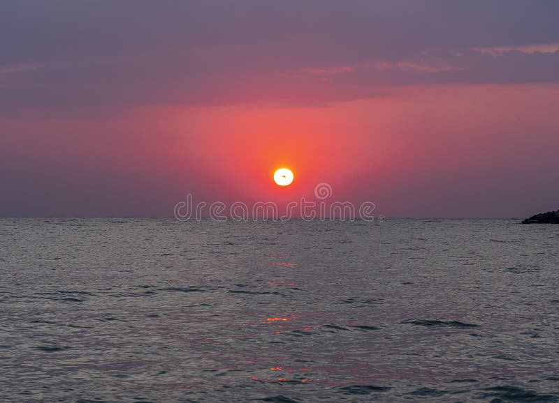 Big sun over sea sunrise stock image. Image of wave - 198530115