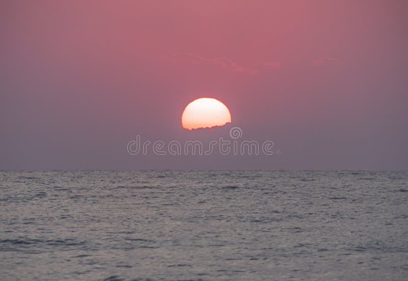 Big sun over sea sunrise stock photo. Image of cloud - 205360300