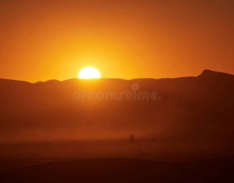 Big Sun Setting in the Desert Full of Dust Stock Image - Image of wave ...