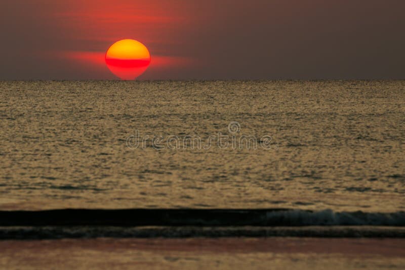 Big Sun Setting Down Over the Sea Stock Photo - Image of beach ...