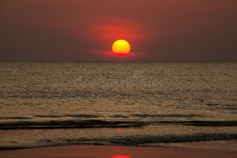 Big Sun Setting Down Over the Sea Stock Photo - Image of clouds ...