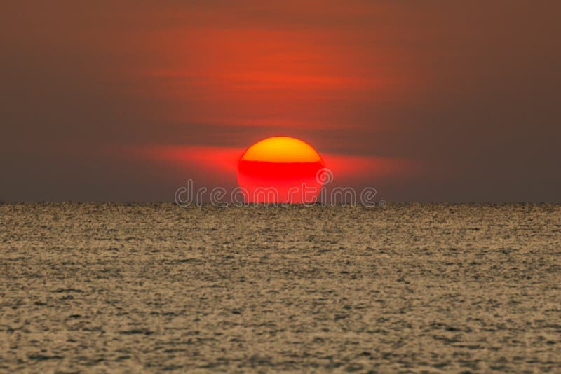 Big Sun Setting Down Over the Sea Stock Photo - Image of heat ...