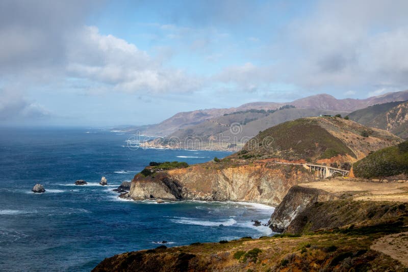 Big Sur Coastline with Rocky Cliffs, Blue Sky and Puffy White Clouds ...