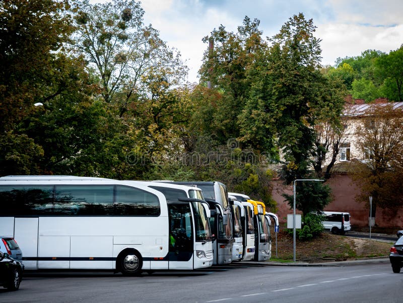 Big Tour Buses in the Parking Lot Stock Image - Image of park ...
