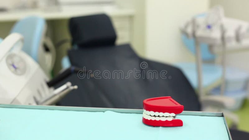 Big Toy Jaw Knacks His Teeth on Table in Dental Stock Footage - Video ...