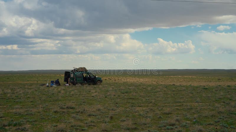 Stop while Traveling on an Endless Plain Stock Photo - Image of field ...