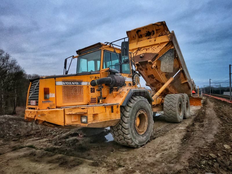 Big Truck Doing Bridge Construction Work Near Railroad Stock Image ...
