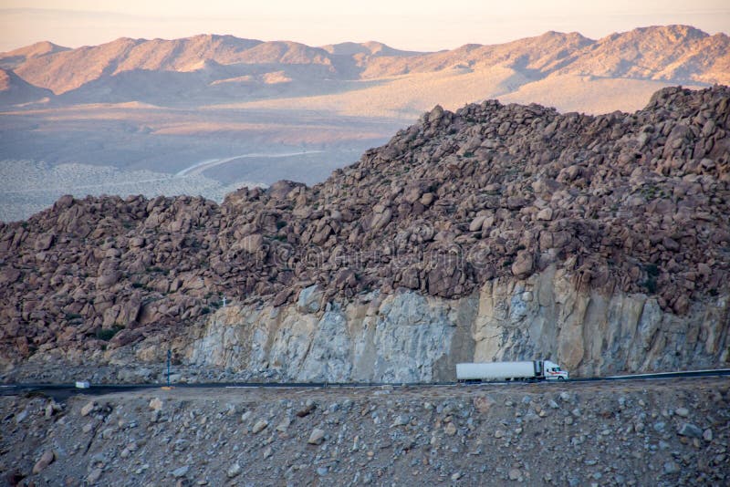 Big Truck Driving through the Mountains and Rocks Stock Image - Image ...