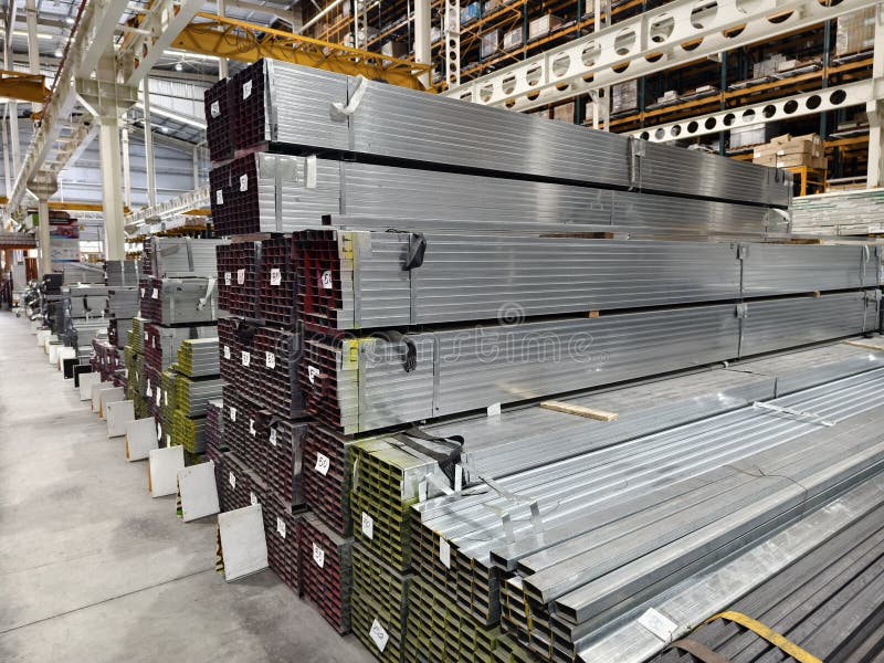 A Big Warehouse Packed with Numerous Metallic Nets and Profile Stock ...