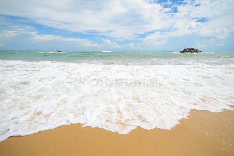 Big wave into the beach stock photo. Image of travel - 54871164