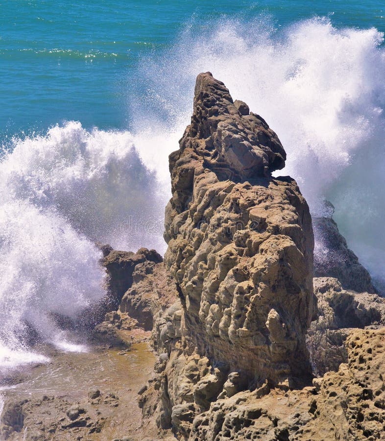 Big wave crashes on rocks stock image. Image of rocks - 52102805