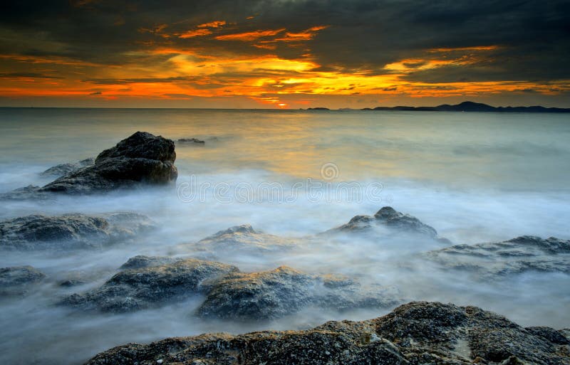 Big Wave and the Rock with Sunset Sky Stock Photo - Image of rock ...