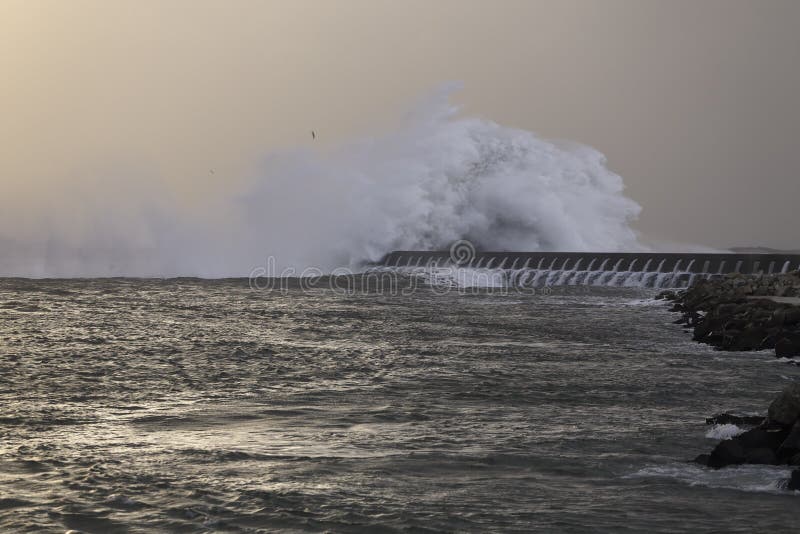 Big wave splash at sunset stock image. Image of power - 174419235