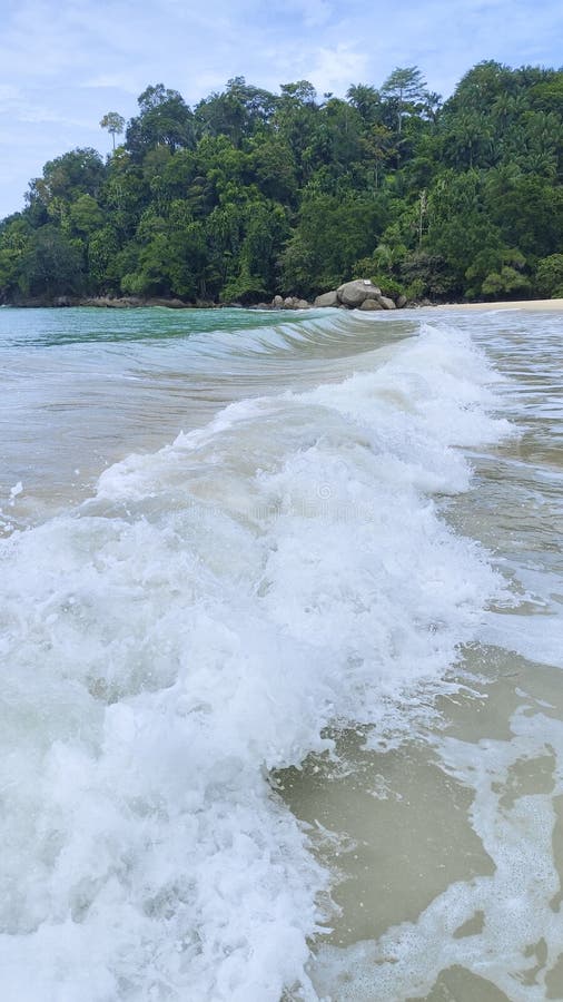 Big waves on a clean beach stock image. Image of green - 388161709