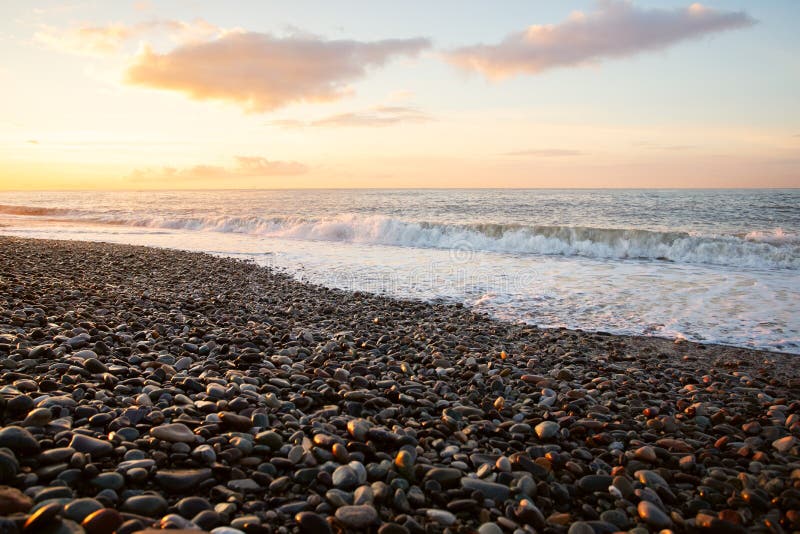 Big Waves with Foam on the Pebbly Beach on the Sunset Stock Photo ...