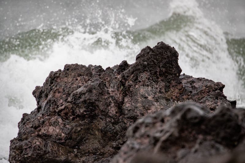 Big Waves Hitting the Rock in the Beach Stock Photo - Image of beach ...