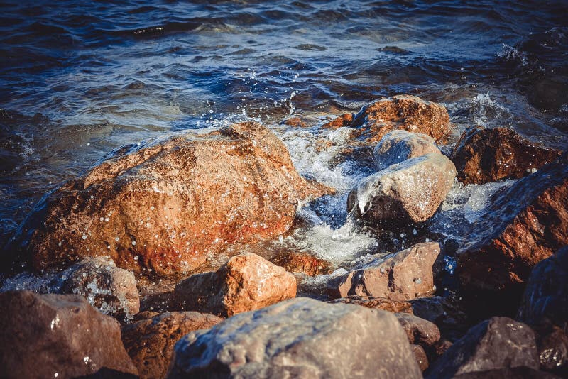 Big Wet Rocks, Splashing and Shining Sun Stock Photo - Image of rock ...