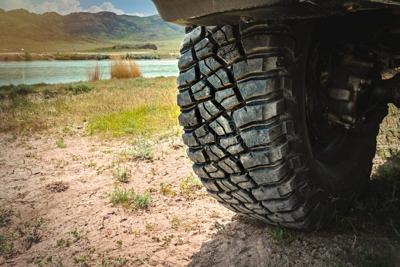 Big Wheel 4x4 SUV with Aggressive Tread on a Trip in the Wild Stock ...