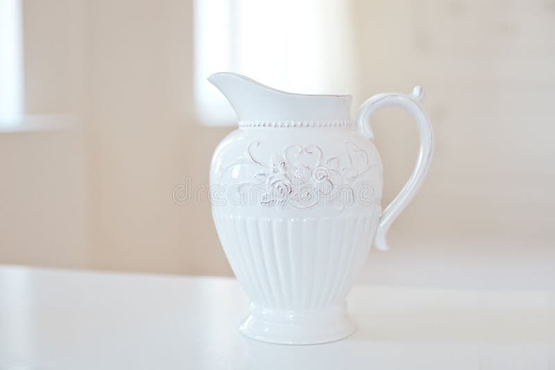 Big White Ceramic Jug on the Table in Big Bright Room Stock Photo ...