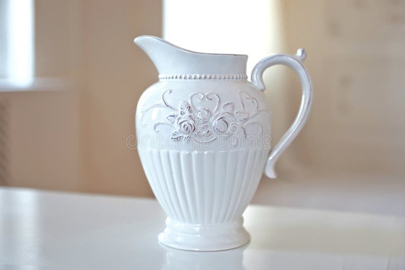 Big White Ceramic Jug on the Table in Big Bright Room Stock Photo ...