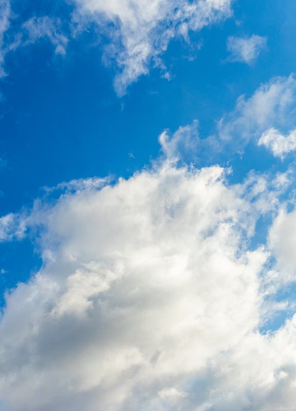 Big White Fluffy Cloud in the Blue Sky in Sunny Weather, Vertical ...